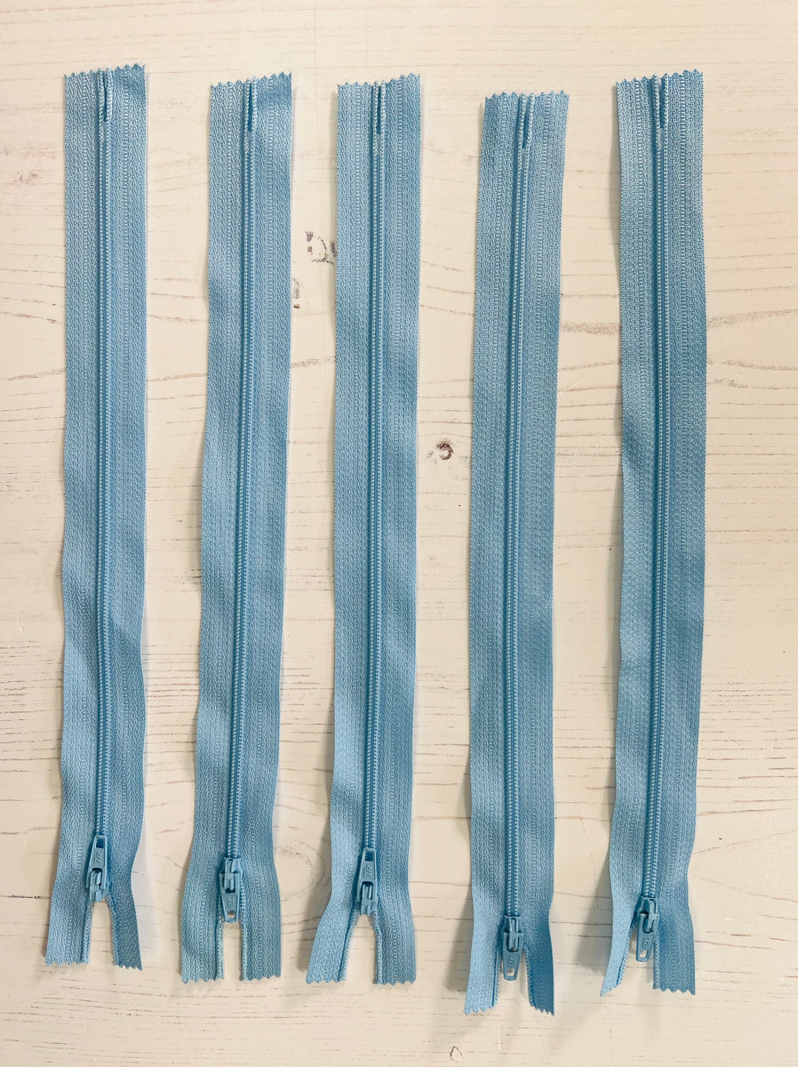 zips 10" long x 5 - colour pale blue as shown – owl and sewing cat